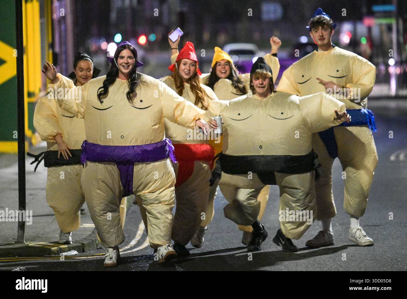 King Street, Wigan, December 26th 2025 - Revellers in various fancy ...
