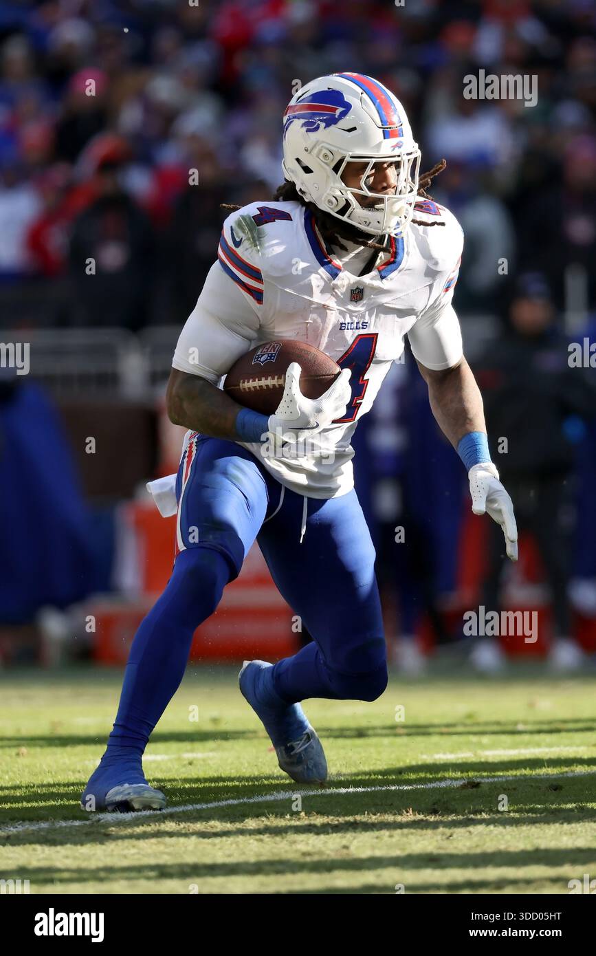 Buffalo Bills running back James Cook (4) runs with the ball during an ...
