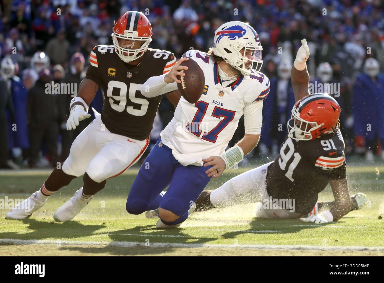Buffalo Bills quarterback Josh Allen (17) falls while running from ...