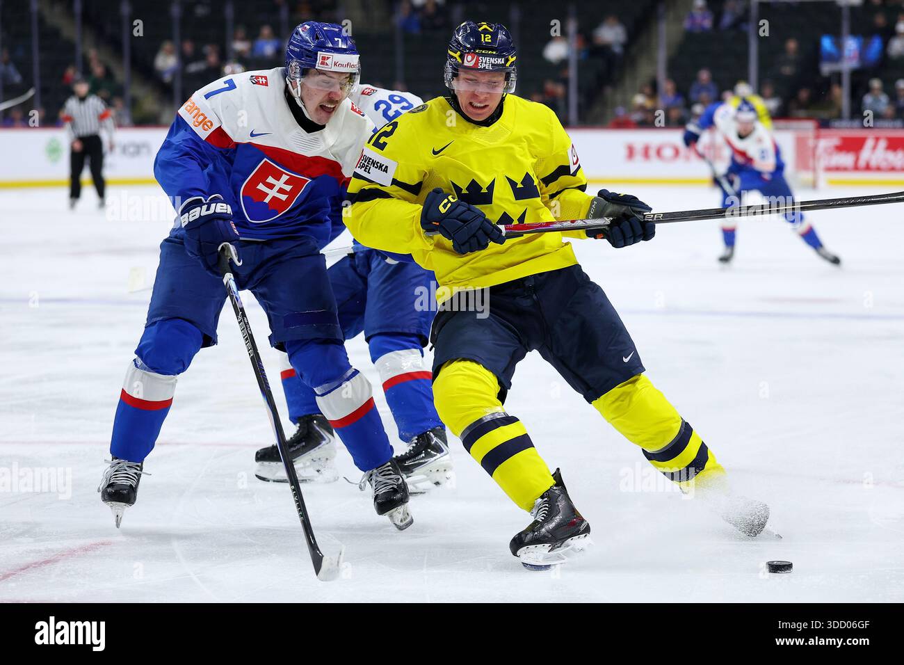 Sweden forward Milton Gastrin (12) and Slovakia defenseman Adam Kalman ...