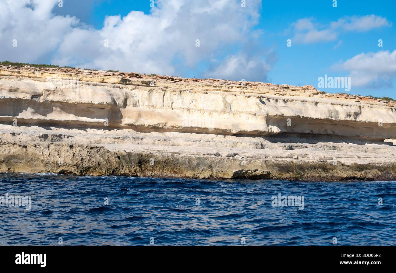 Spectacular chalk cliffs and rugged limestone coastline of the Delimara ...
