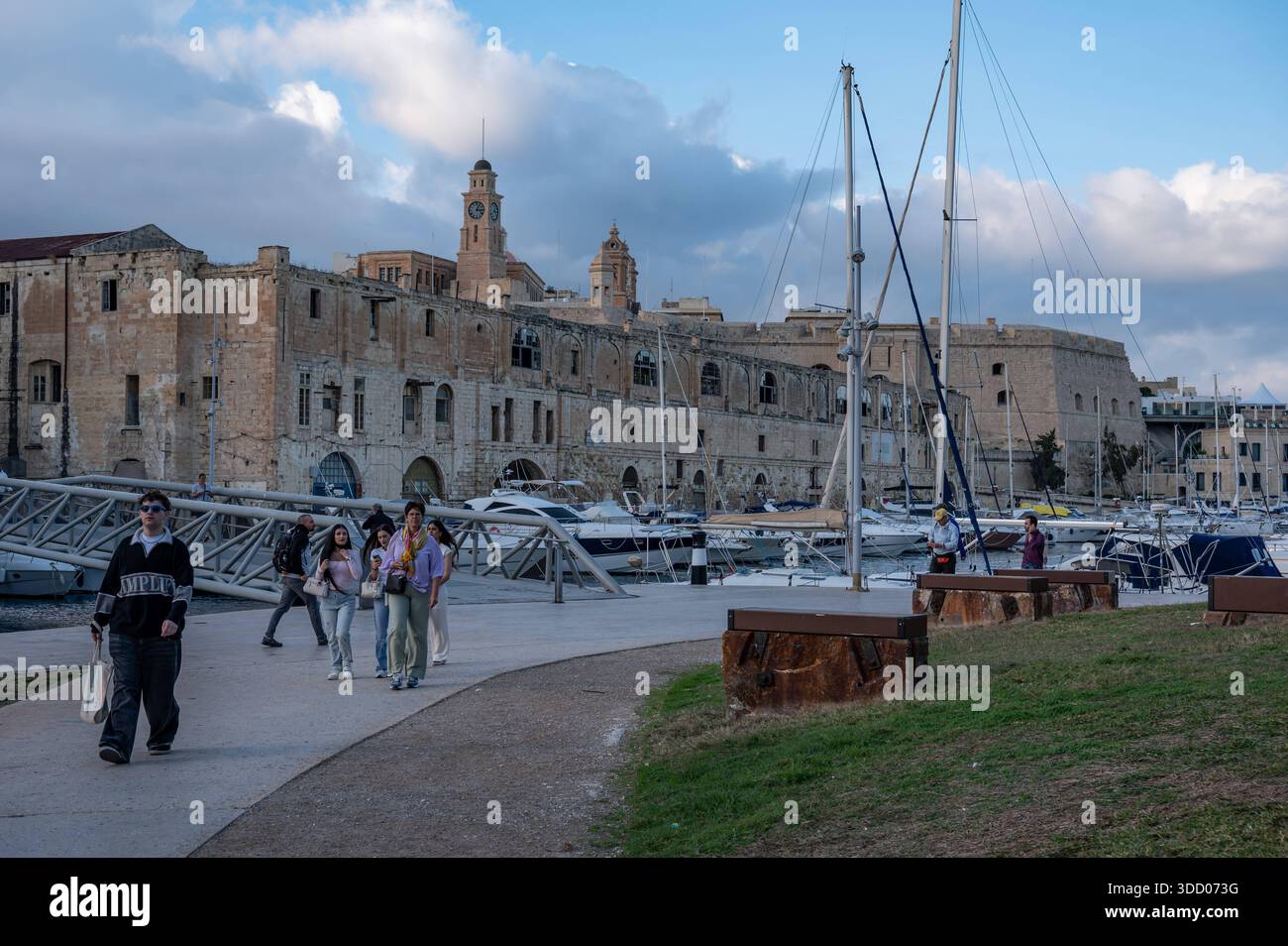 View over Birgu harbor with pleasure boats, historic monuments, and ...