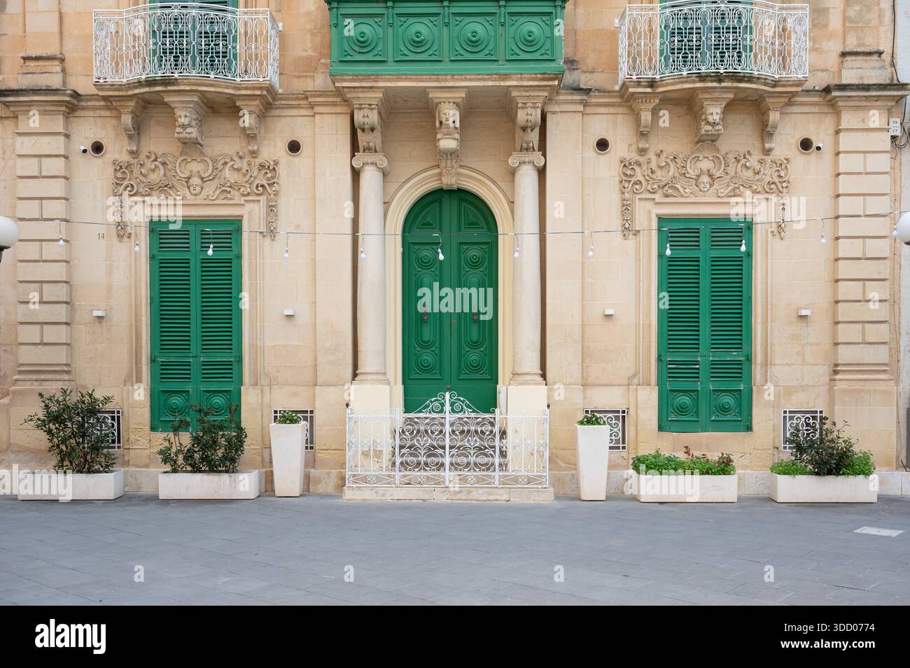 Narrow streets lined with simple houses featuring colorful wooden doors ...