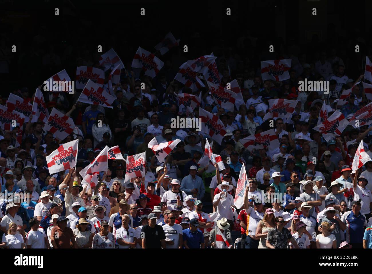 Fans of the England cricket team, known as the Barmy Army, wave flags ...