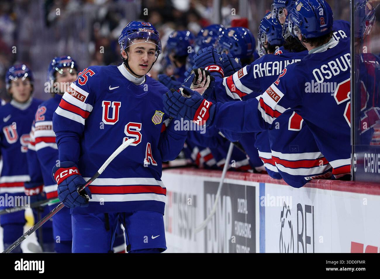 United States defenseman Chase Reid celebrates his goal with teammates ...