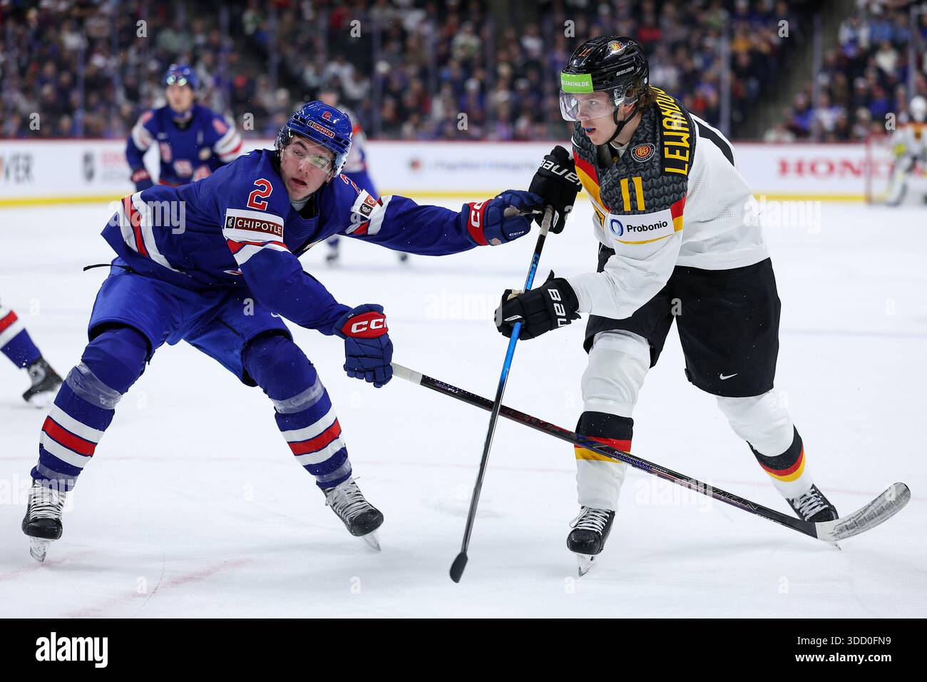 Germany forward David Lewandowski, right, shoots the puck as United ...