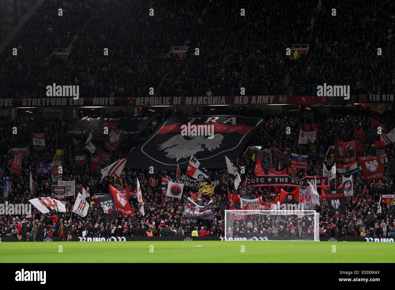 United fans wave flags in the crowd ahead of the Manchester United v ...