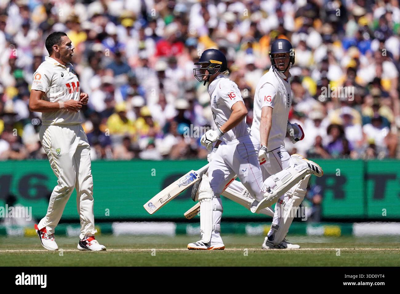 England’s Jacob Bethell (centre) and Zak Crawley (right) run past ...