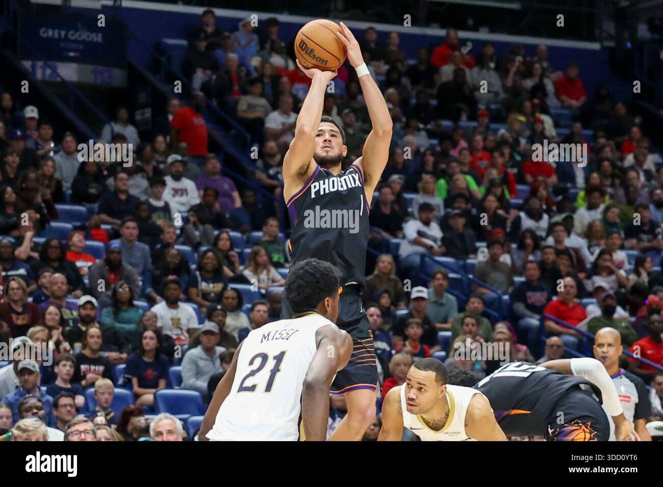 Phoenix Suns guard Devin Booker (1) goes up to shoot a jumper over New ...