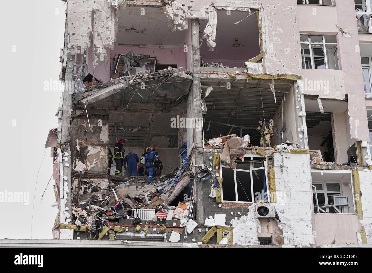 Rescuers work on the scene of a building damaged by a Russian attack in ...