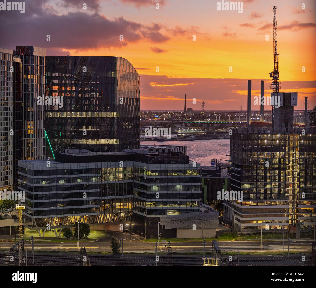 Roof top sunset view of Melbourne docklands and the M2 bridge in ...