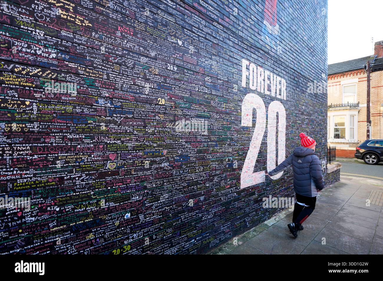 Fans at The "Forever 20" wall, a tribute mural in memory of Diogo Jota ...