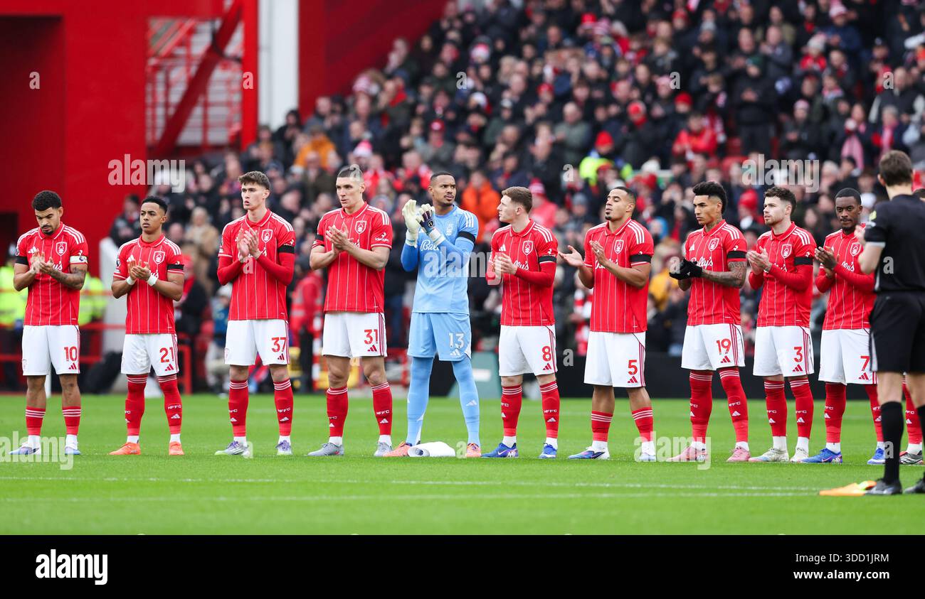 Nottingham Forest players during a moments applause in memory of John ...