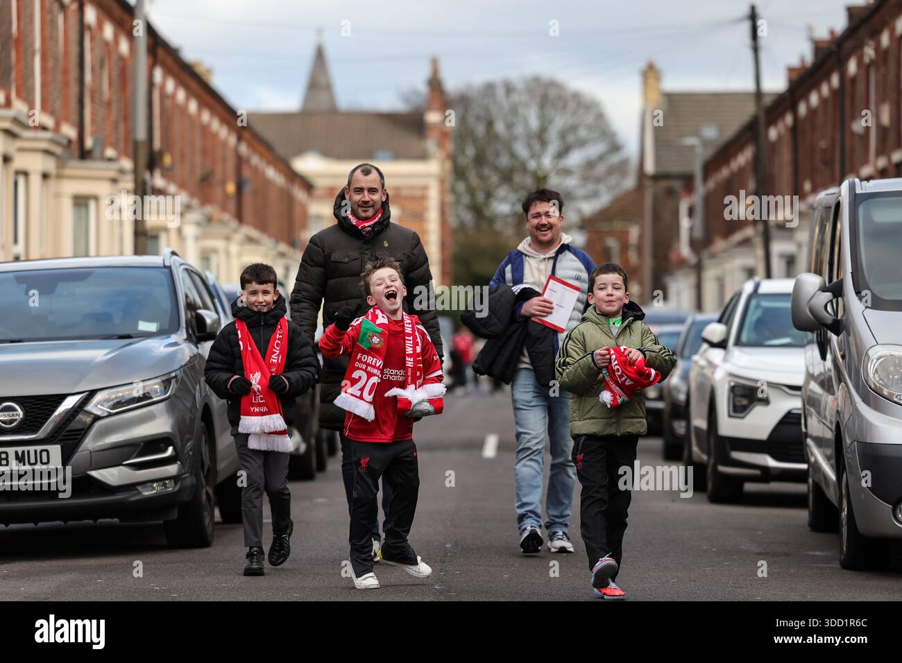 Liverpool fans make their way to Anfield during the Premier League ...