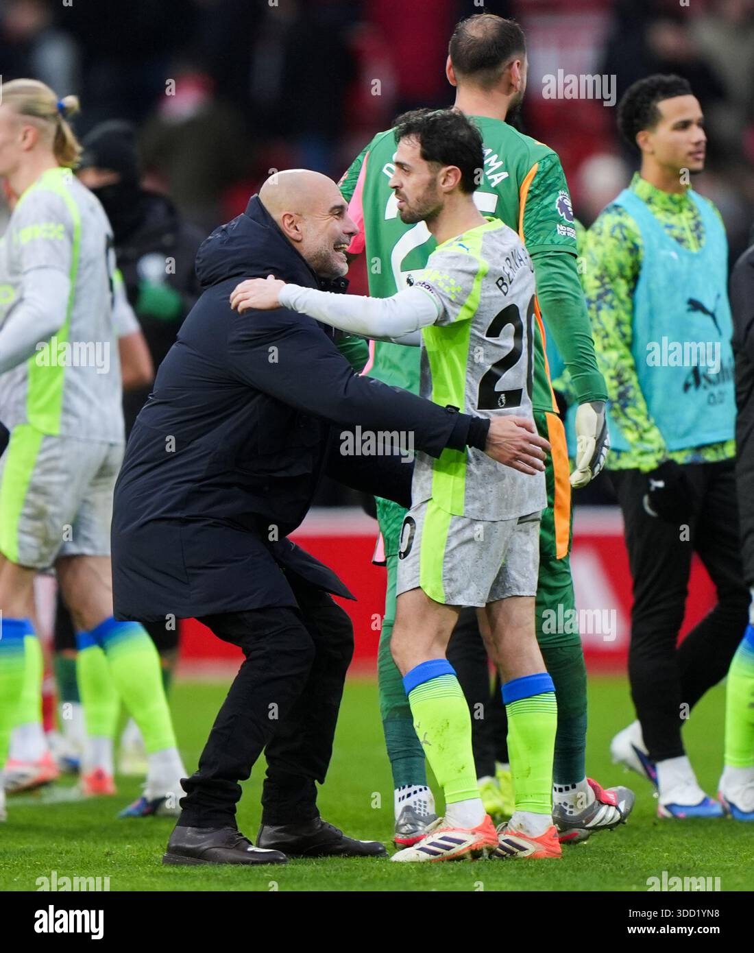 Manchester City manager Pep Guardiola with Bernardo Silva following the ...