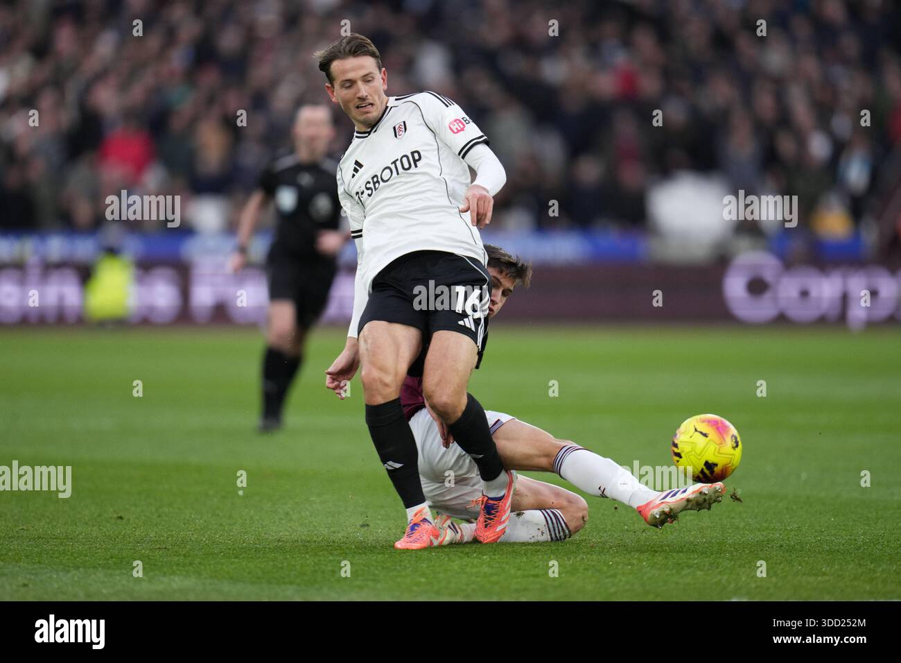 Ollie Scarles of West Ham United attempts tackle on Sander Berge of ...