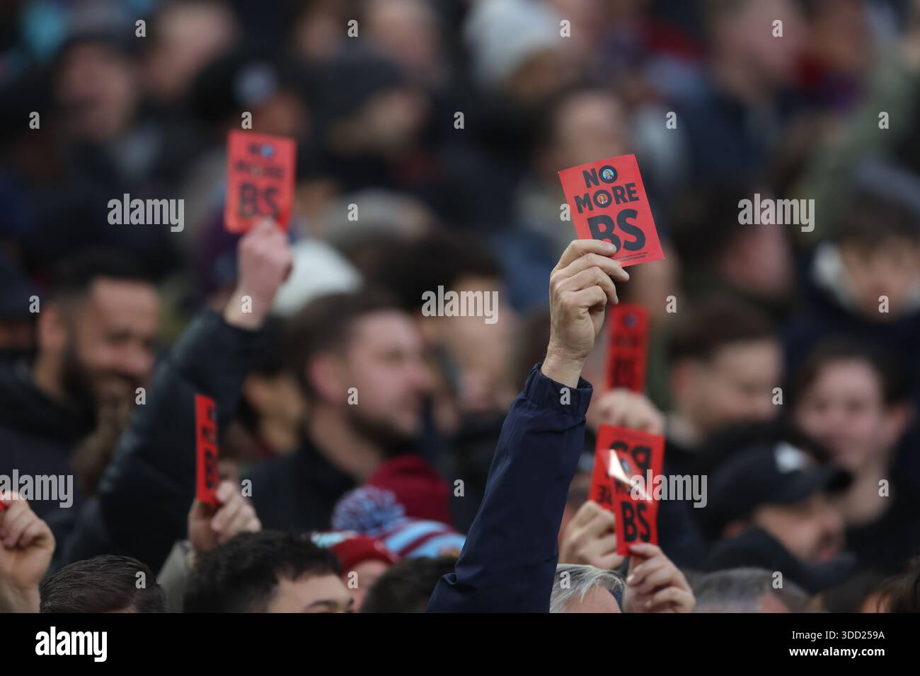 West Ham fans hold up cards during the Premier League match at the ...