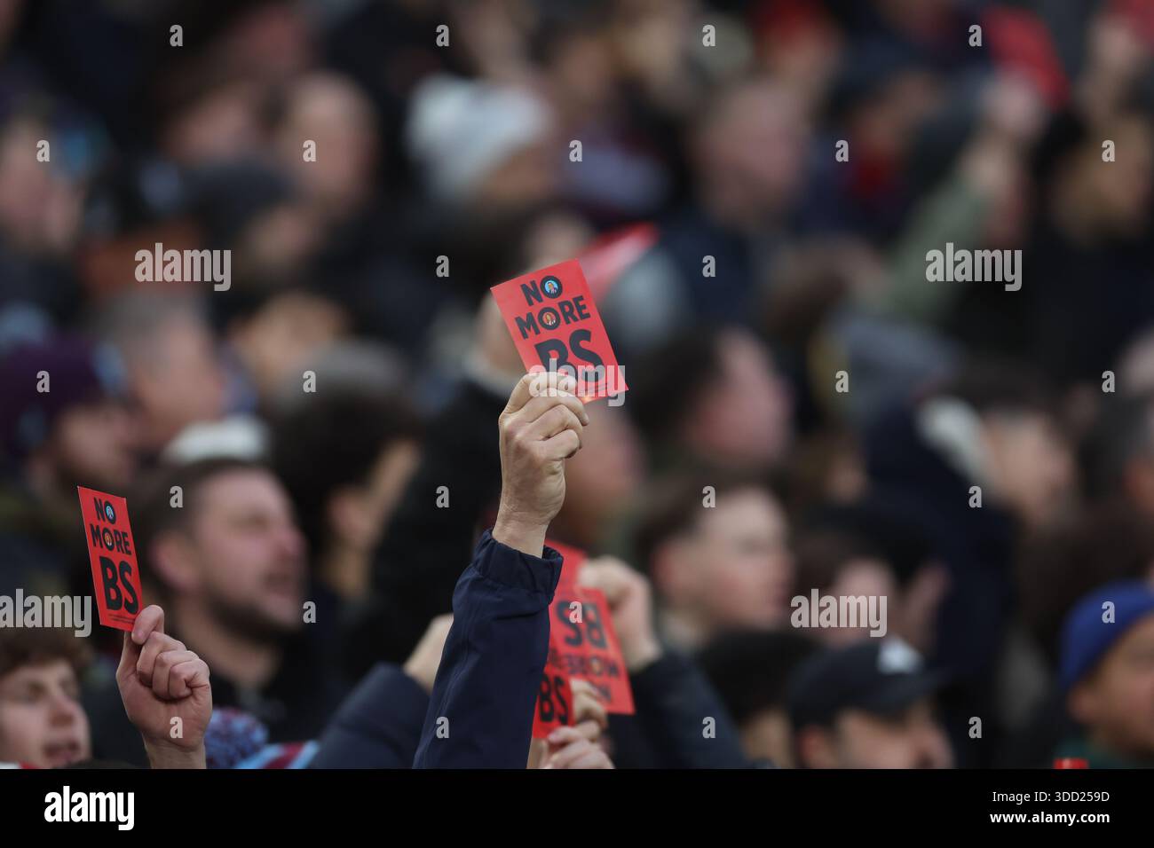 West Ham fans hold up cards during the Premier League match at the ...