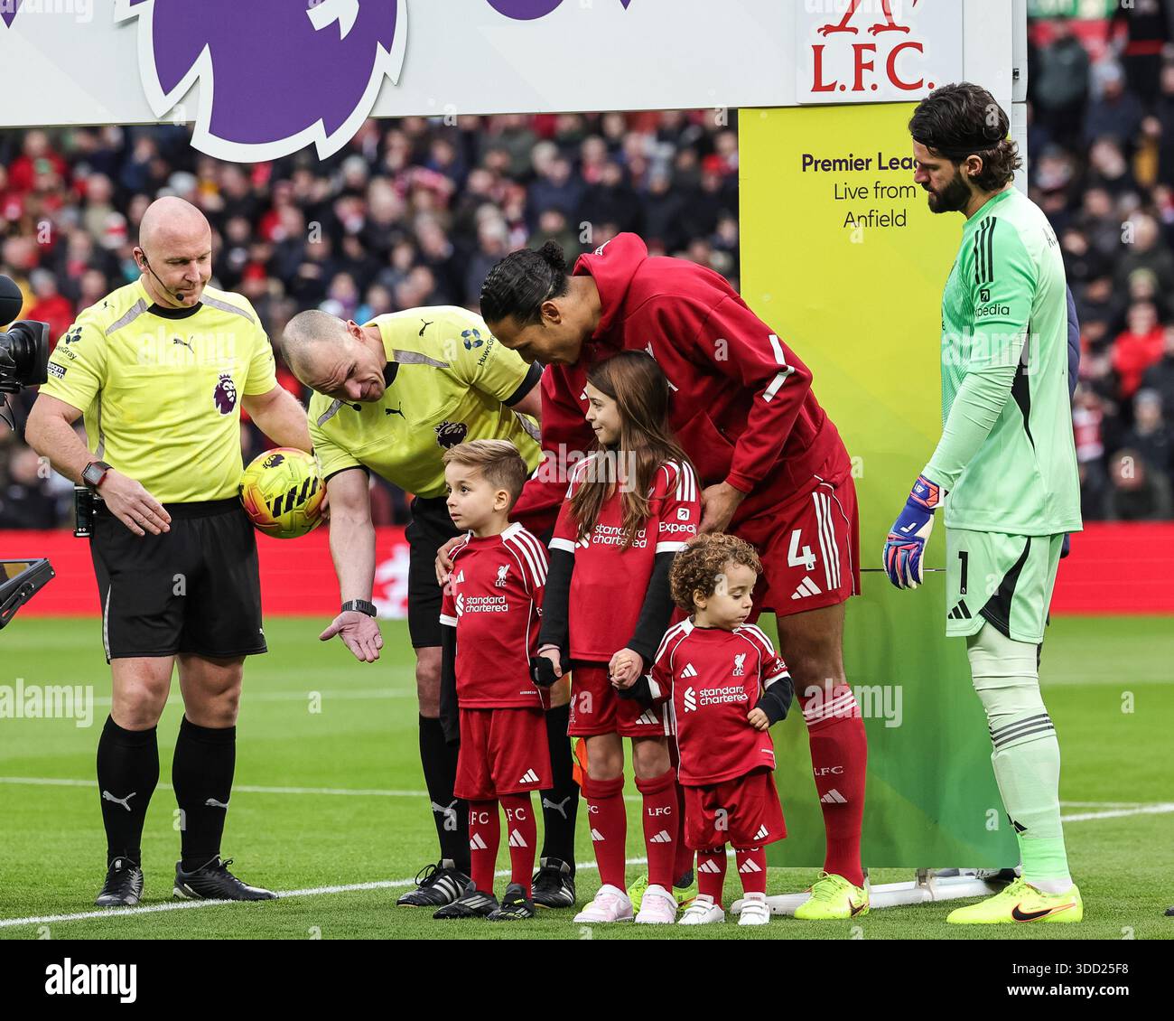 Virgil van Dijk of Liverpool walks out with the children of former ...