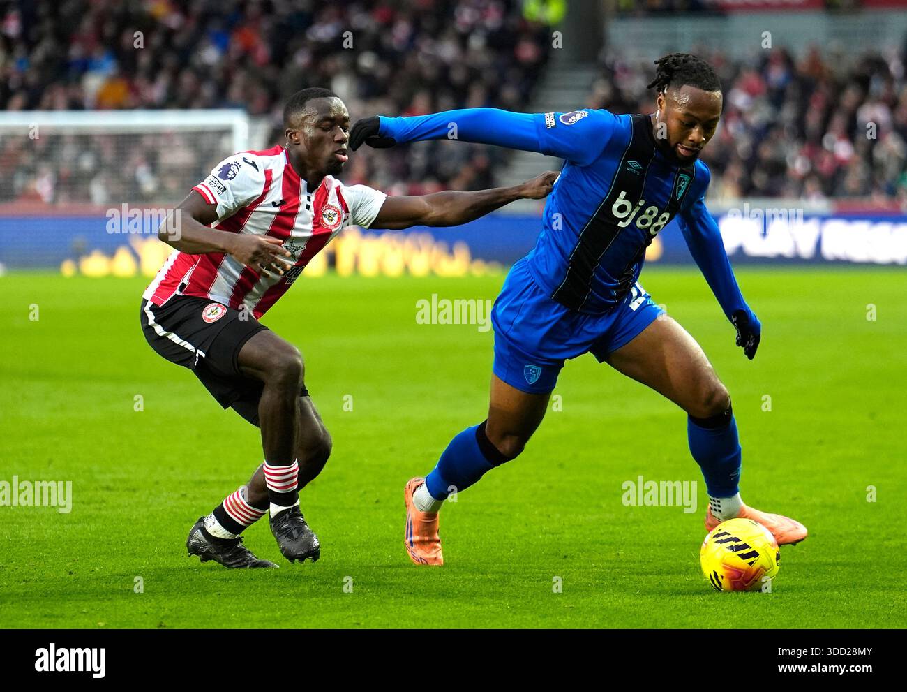 Brentford's Michael Kayode (left) and Bournemouth's Antoine Semenyo ...