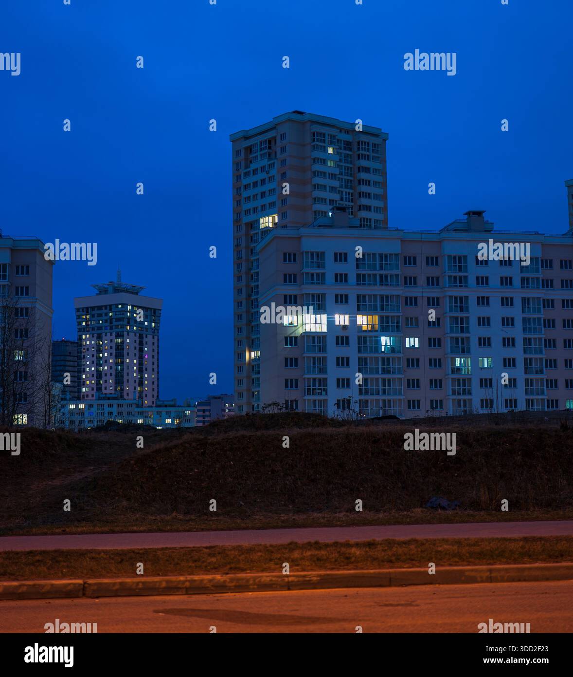 Night scene in Minsk, Belarus shows lit apartment blocks, a stepped ...