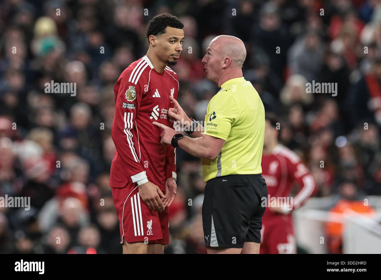 Referee Simon Hooper speaks to Hugo Ekitike of Liverpool during the ...