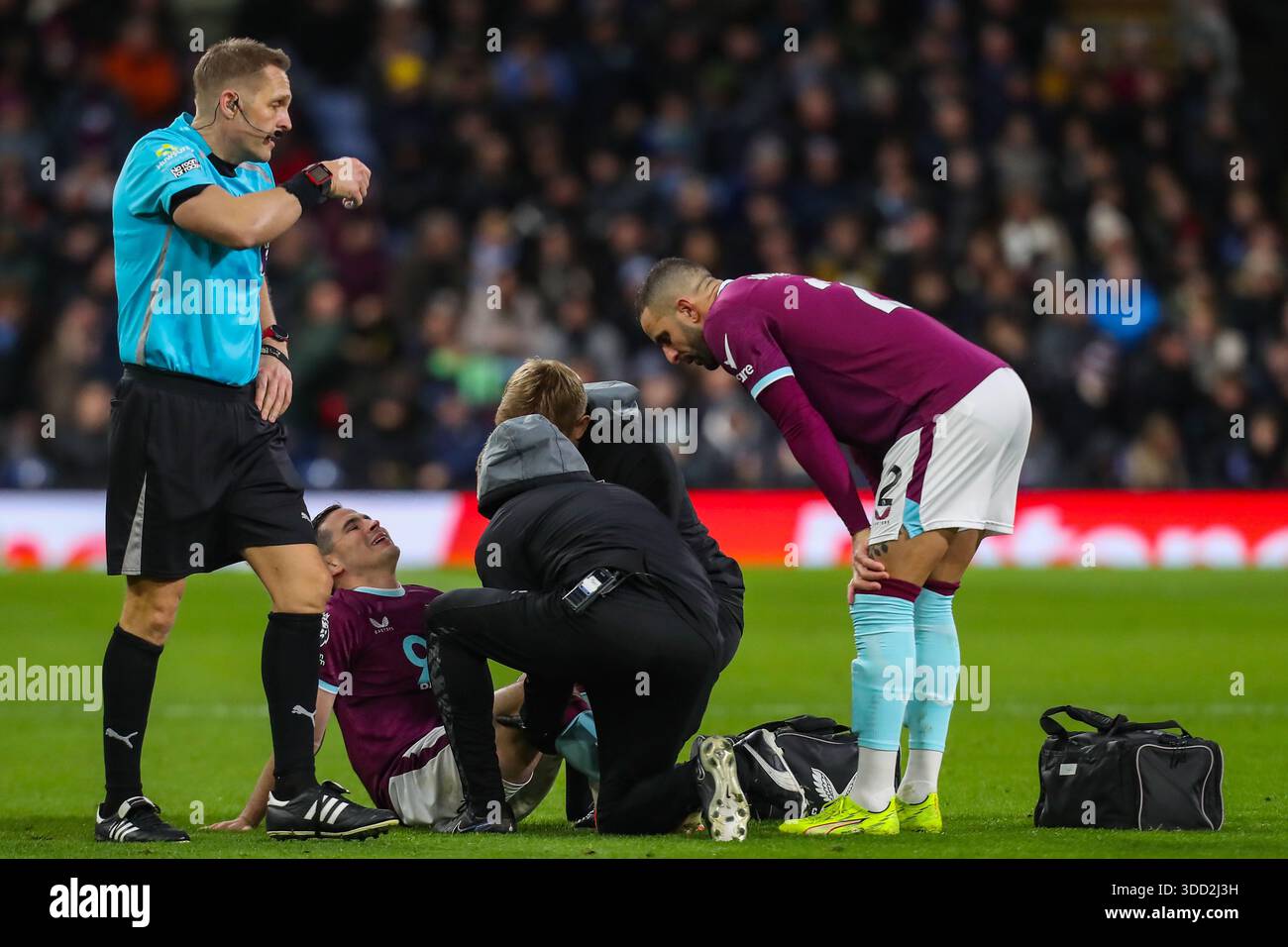 Josh Cullen Of Burley picks up an injury during the Burnley v Everton ...