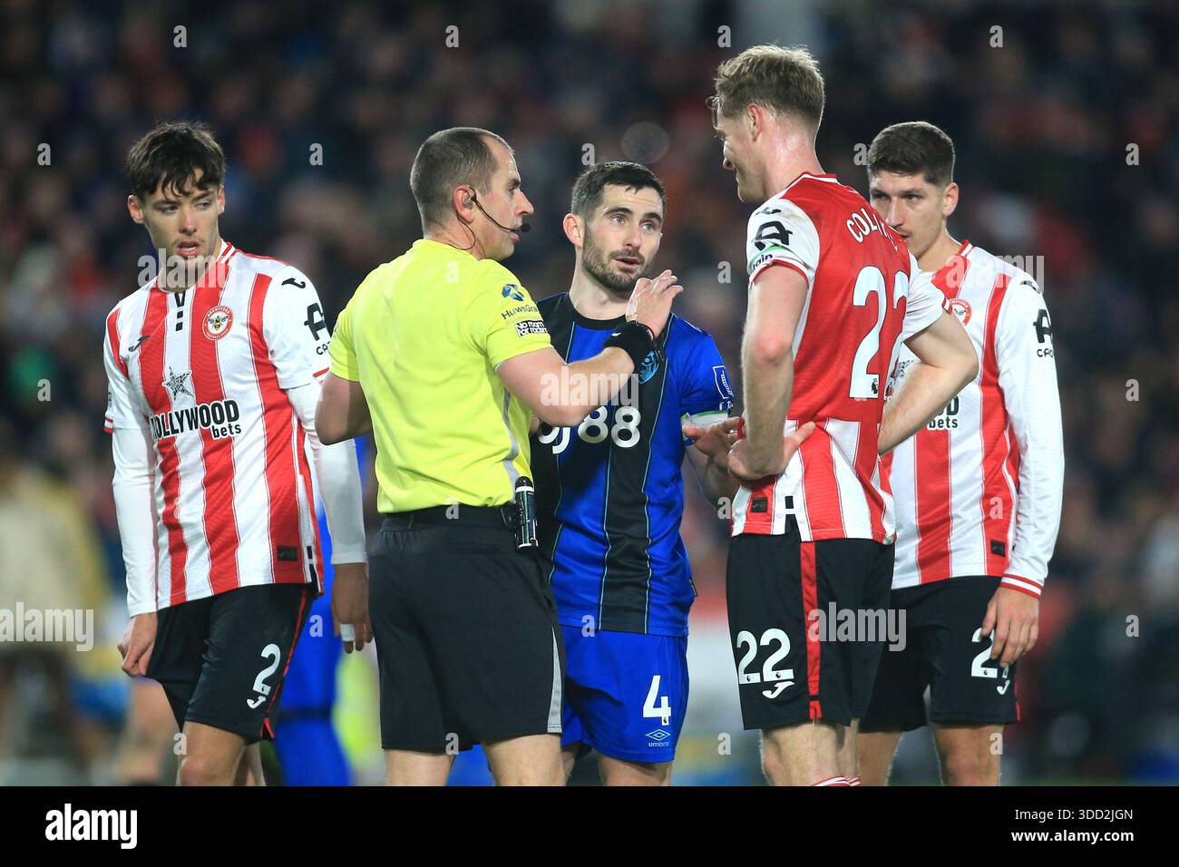 Referee Peter Bankes speaks with Bournemouth's Lewis Cook (centre) and ...