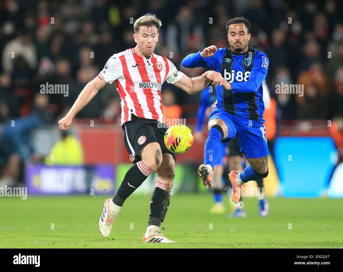 Brentford's Nathan Collins (left) and Bournemouth's Justin Kluivert ...