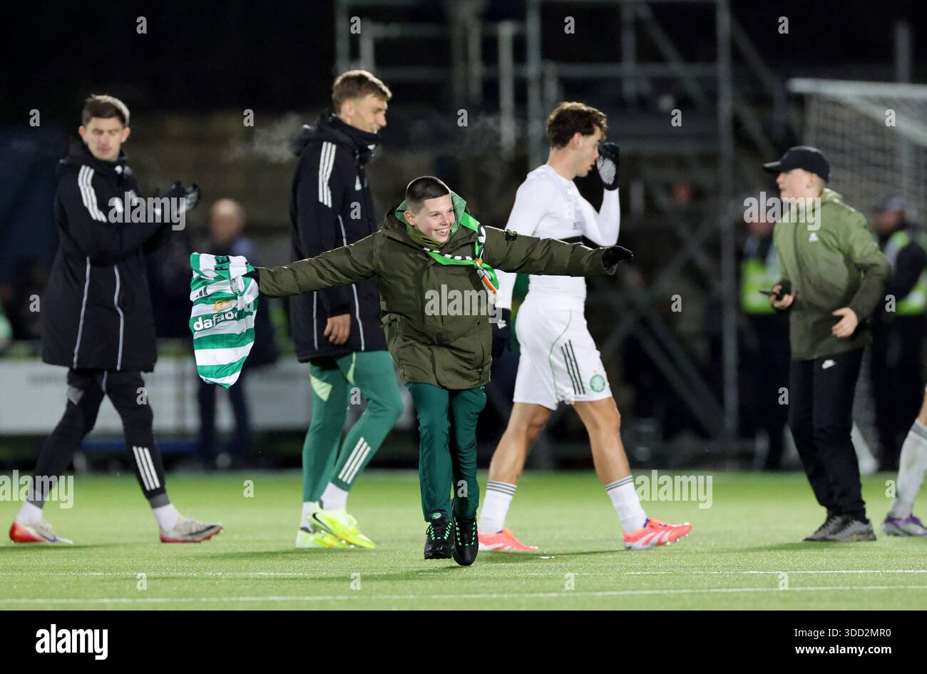 A young Celtic fan celebrates after receving Celtic's Paulo Bernardo's ...