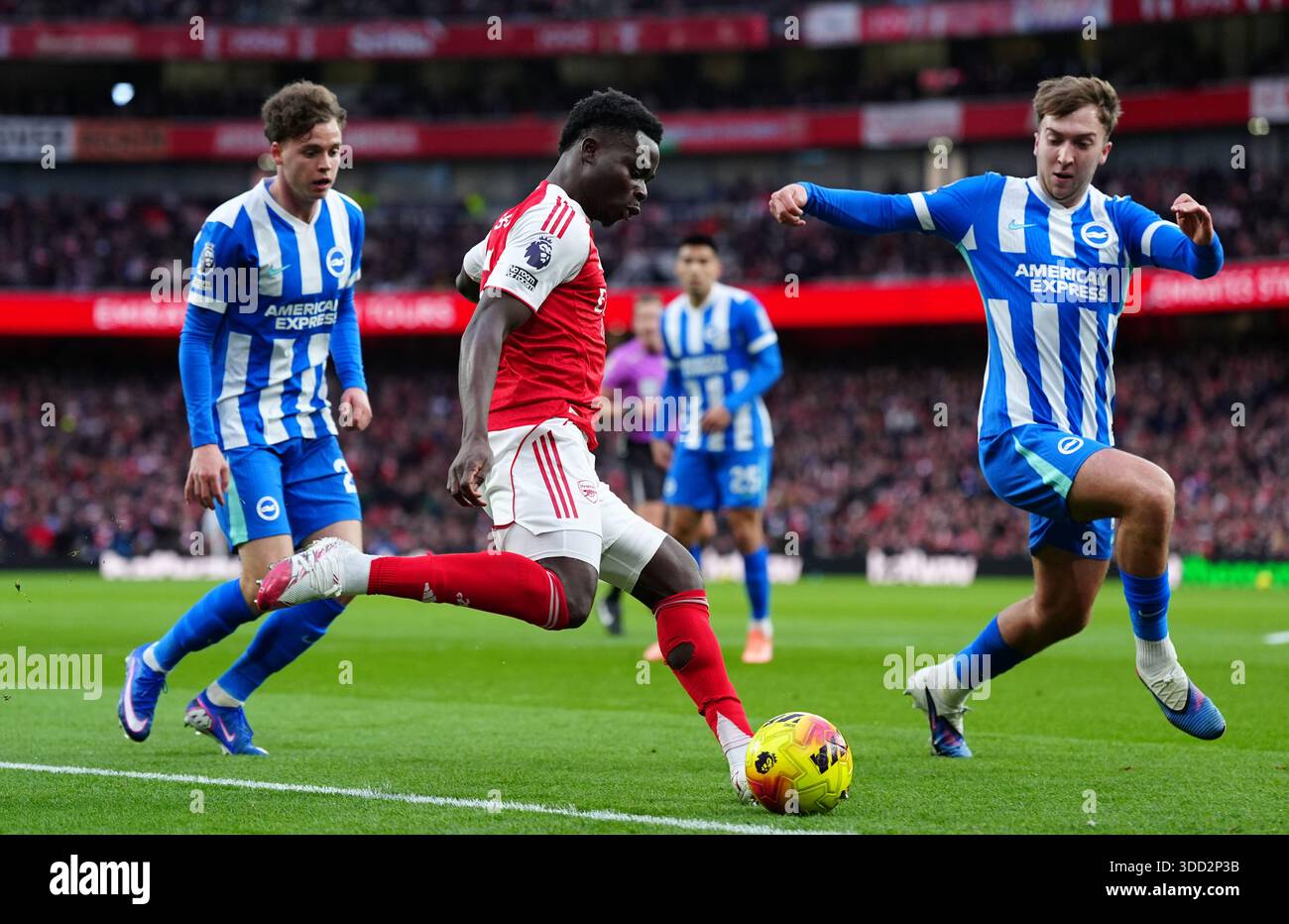 Arsenal's Bukayo Saka crosses the ball during the Premier League match ...