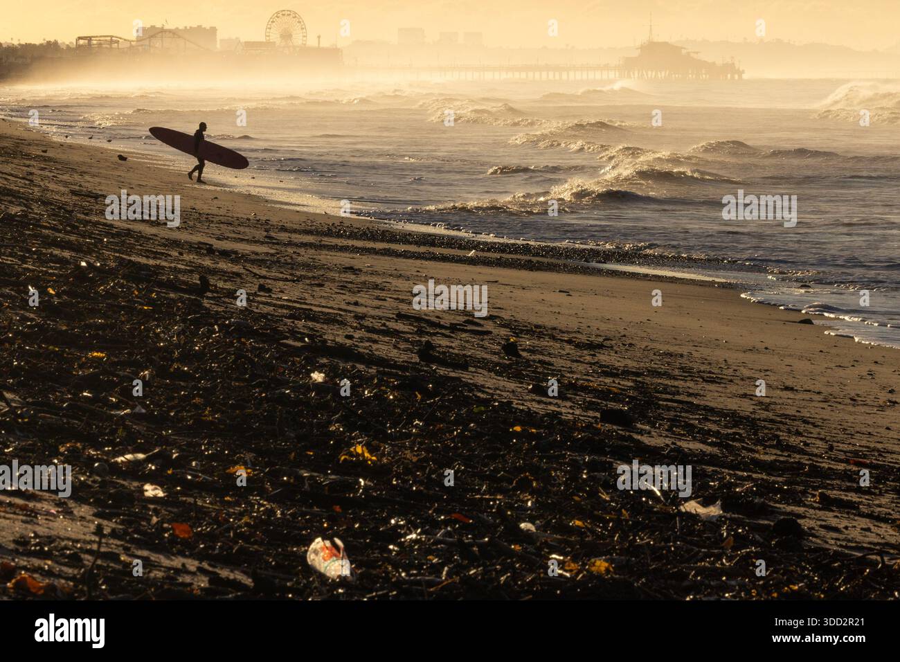 December 27, 2025, Los Angeles, California, USA: A surfer enters the ...
