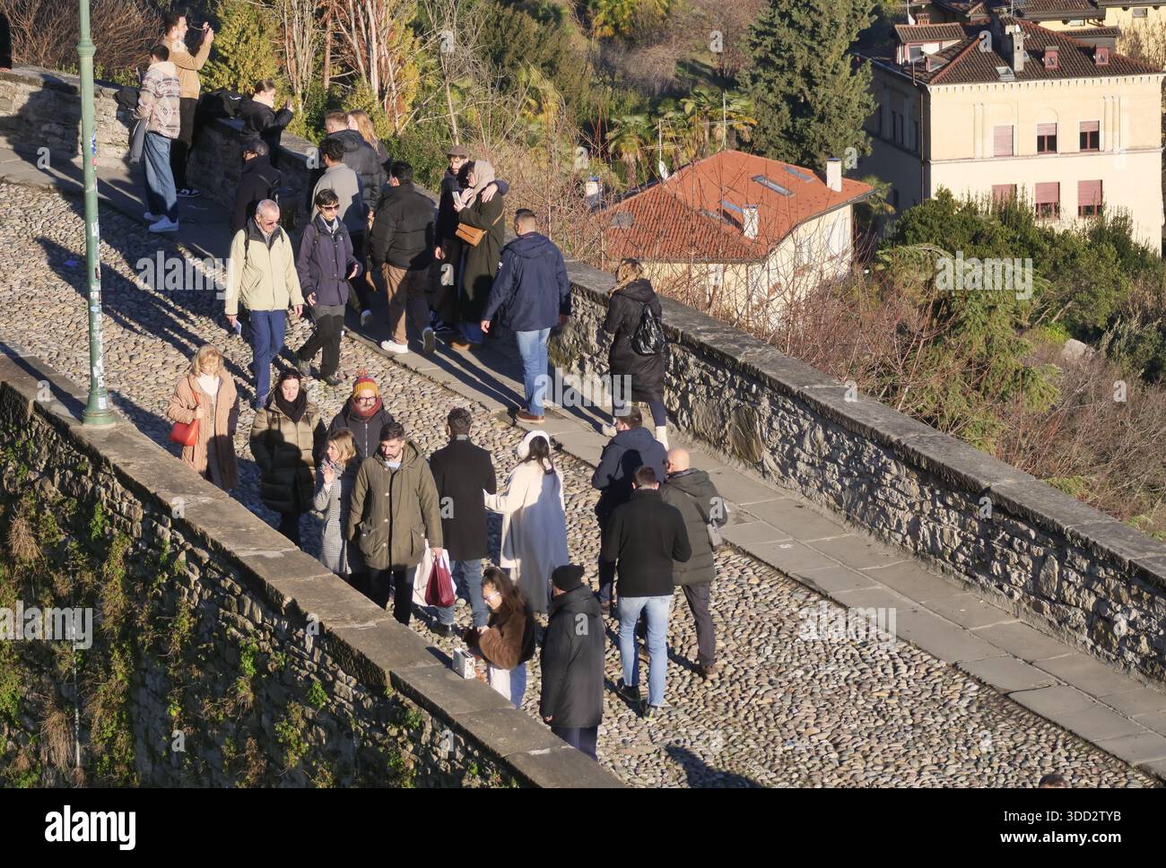 Clear skies return, and numerous tourists wander through the ...