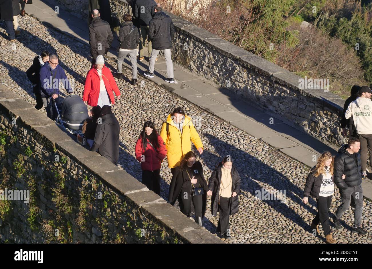 Clear skies return, and numerous tourists wander through the ...