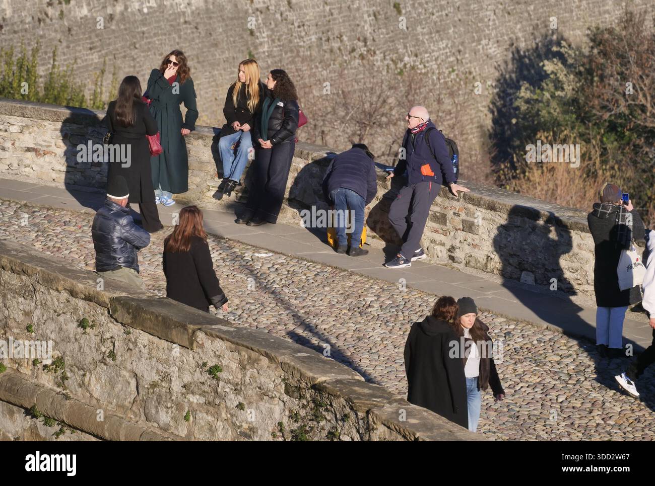 Clear skies return, and numerous tourists wander through the ...