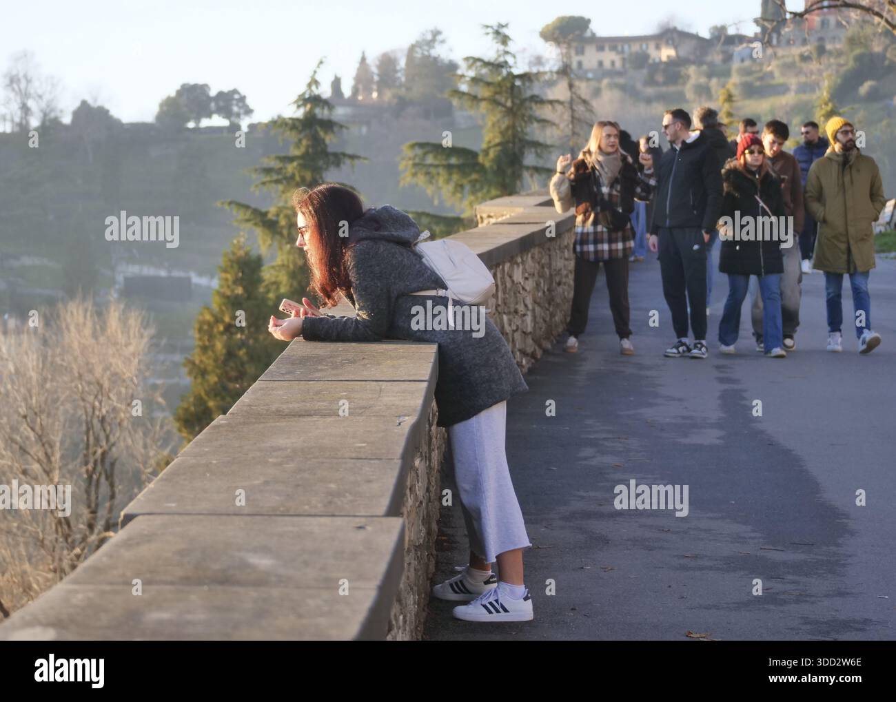 Clear skies return, and numerous tourists wander through the ...