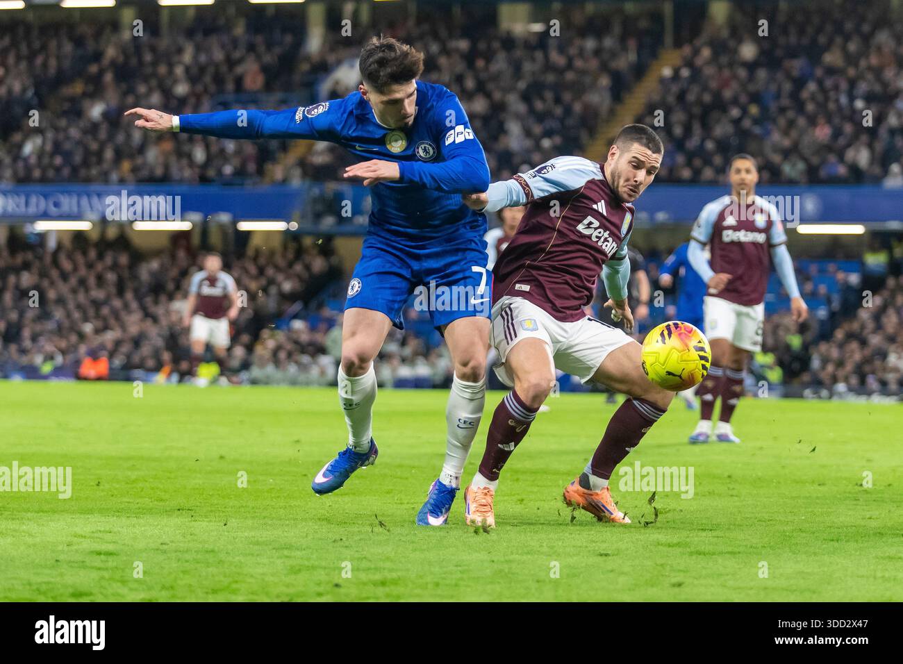 Pedro Neto of Chelsea and Emi Buendía of Aston Villa battle for the ...