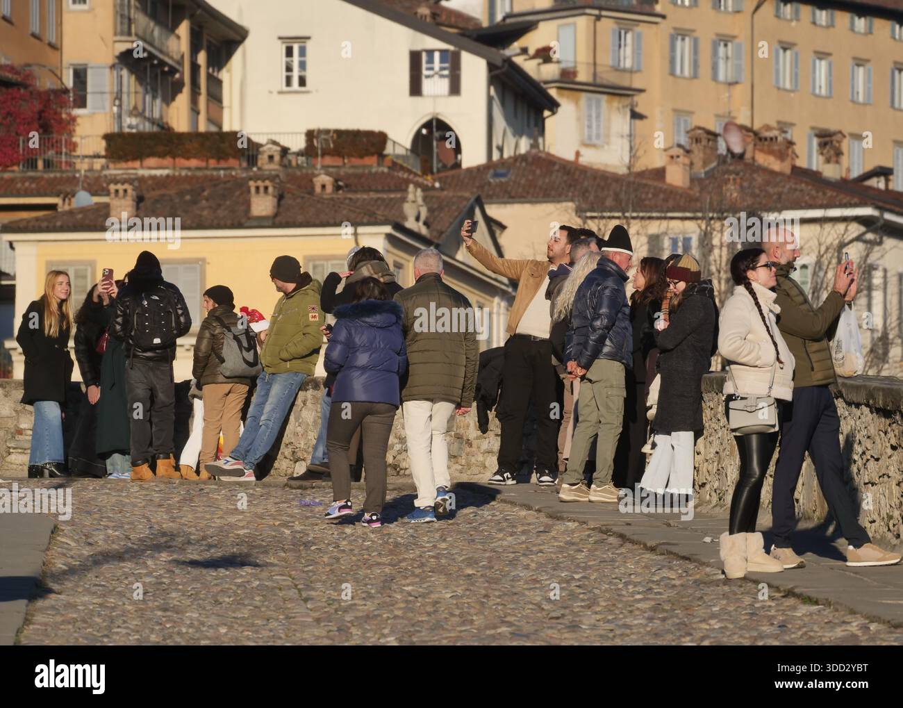 Clear skies return, and numerous tourists wander through the ...