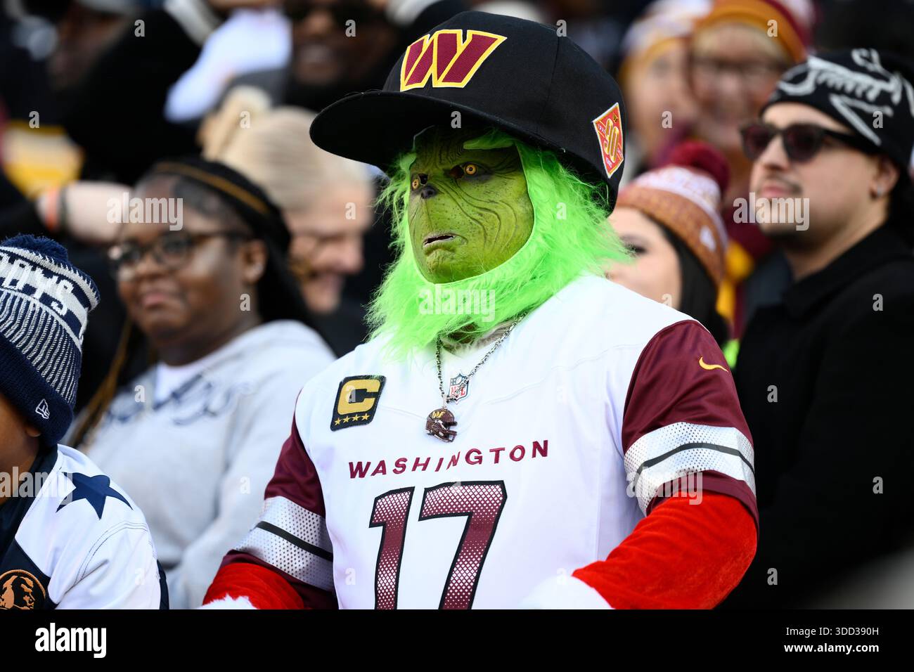 Fans looks on during the first half of an NFL football game between the ...