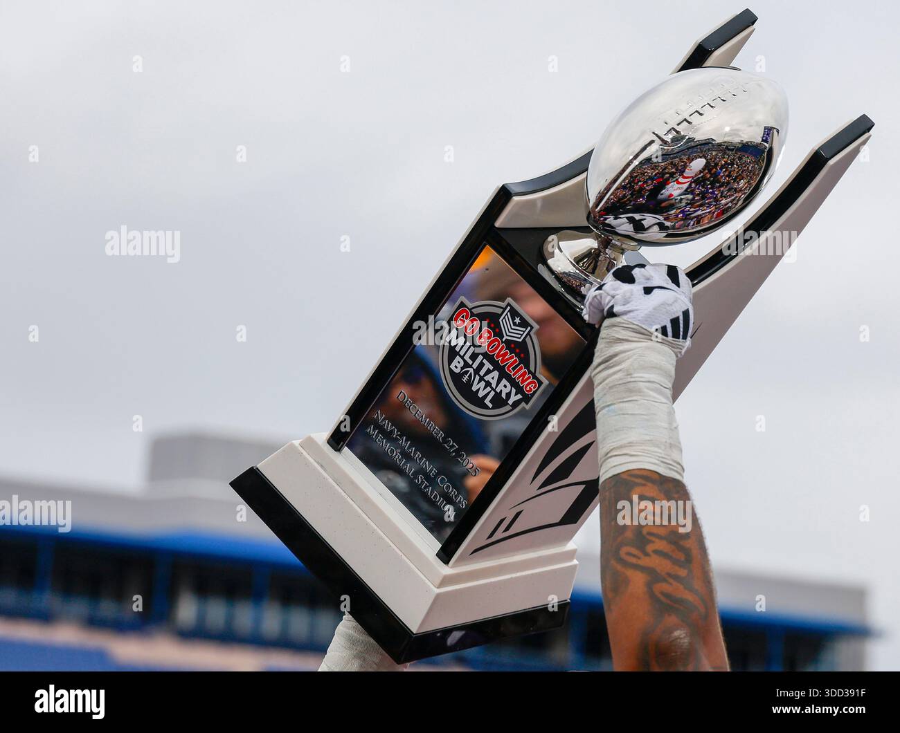 December 27, 2025: The Go Bowling Military Bowl trophy is hoisted after ...