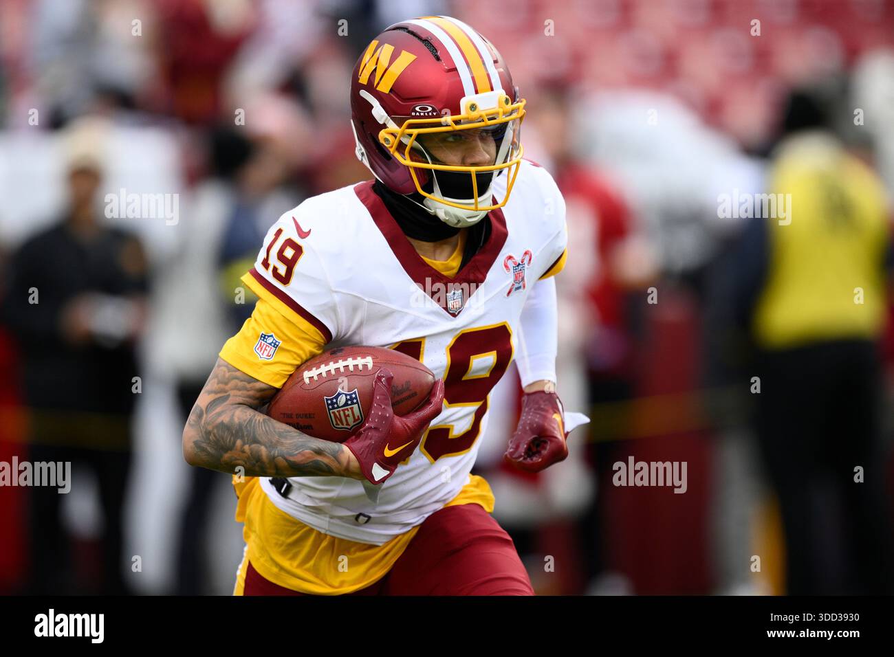 Washington Commanders wide receiver Chris Moore (19) warms up before an ...