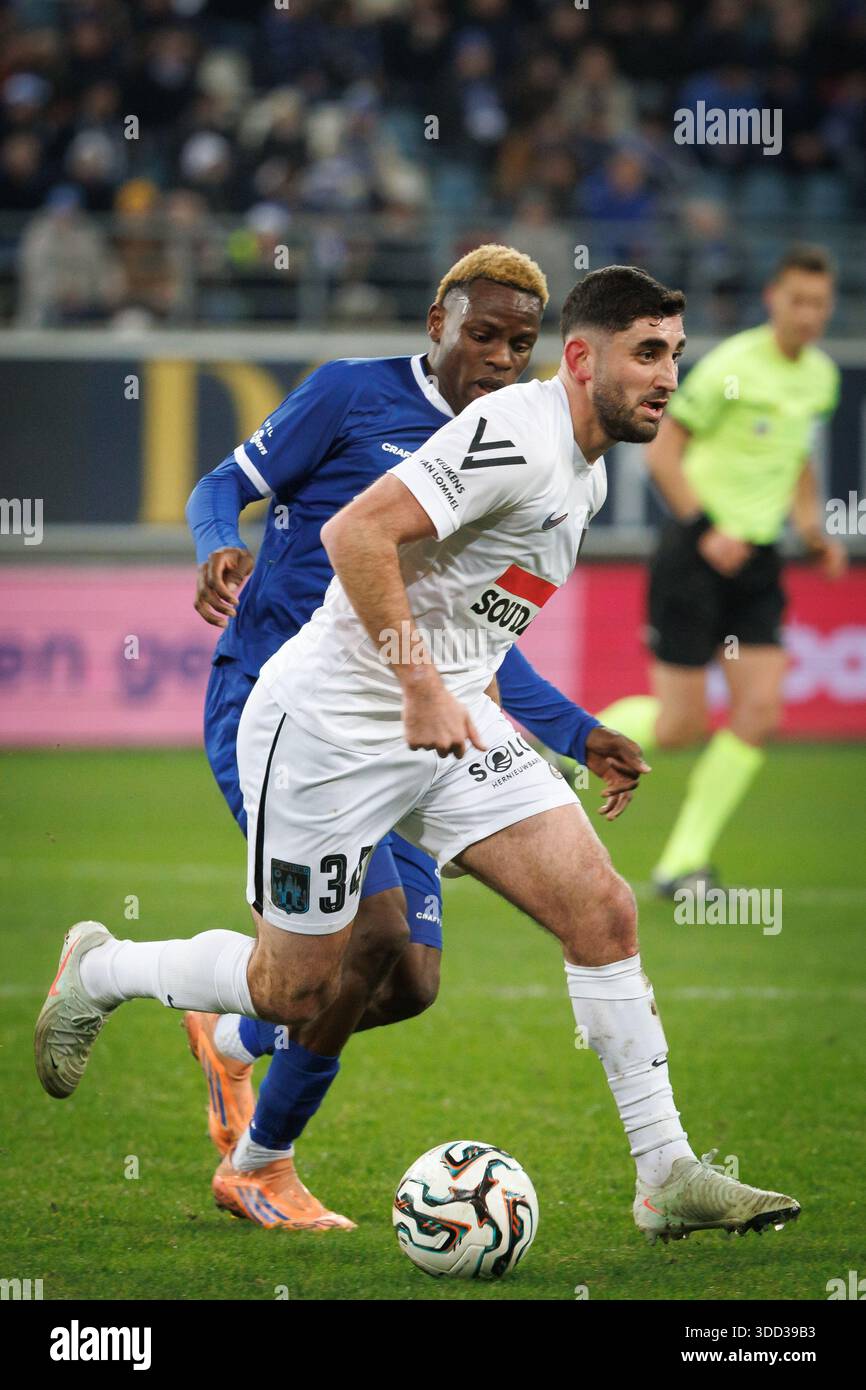 Gent's Hyllarion Goore and Westerlo's Dogucan Haspolat fight for the ...