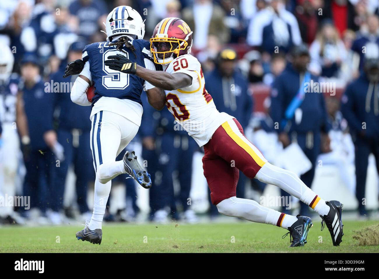 Washington Commanders safety Quan Martin (20) tackles Dallas Cowboys ...