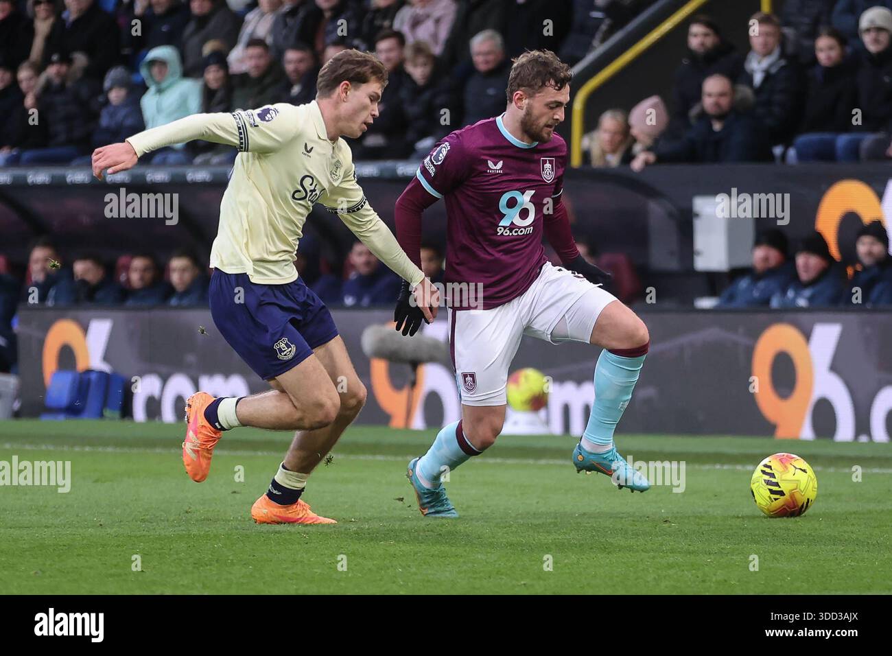 Jacob Bruun Larsen takes the ball past Tyler Dibling during the Premier ...
