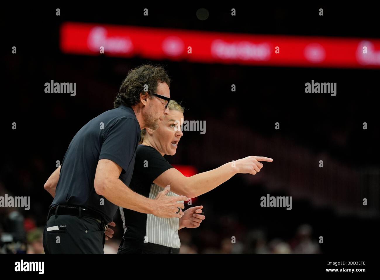 Atlanta Hawks head coach Quin Snyder speaks with official Jenna ...