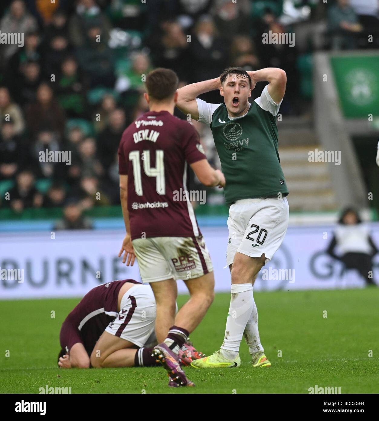 Josh mulligan of hibs foul on claudio braga of hearts hi-res stock ...