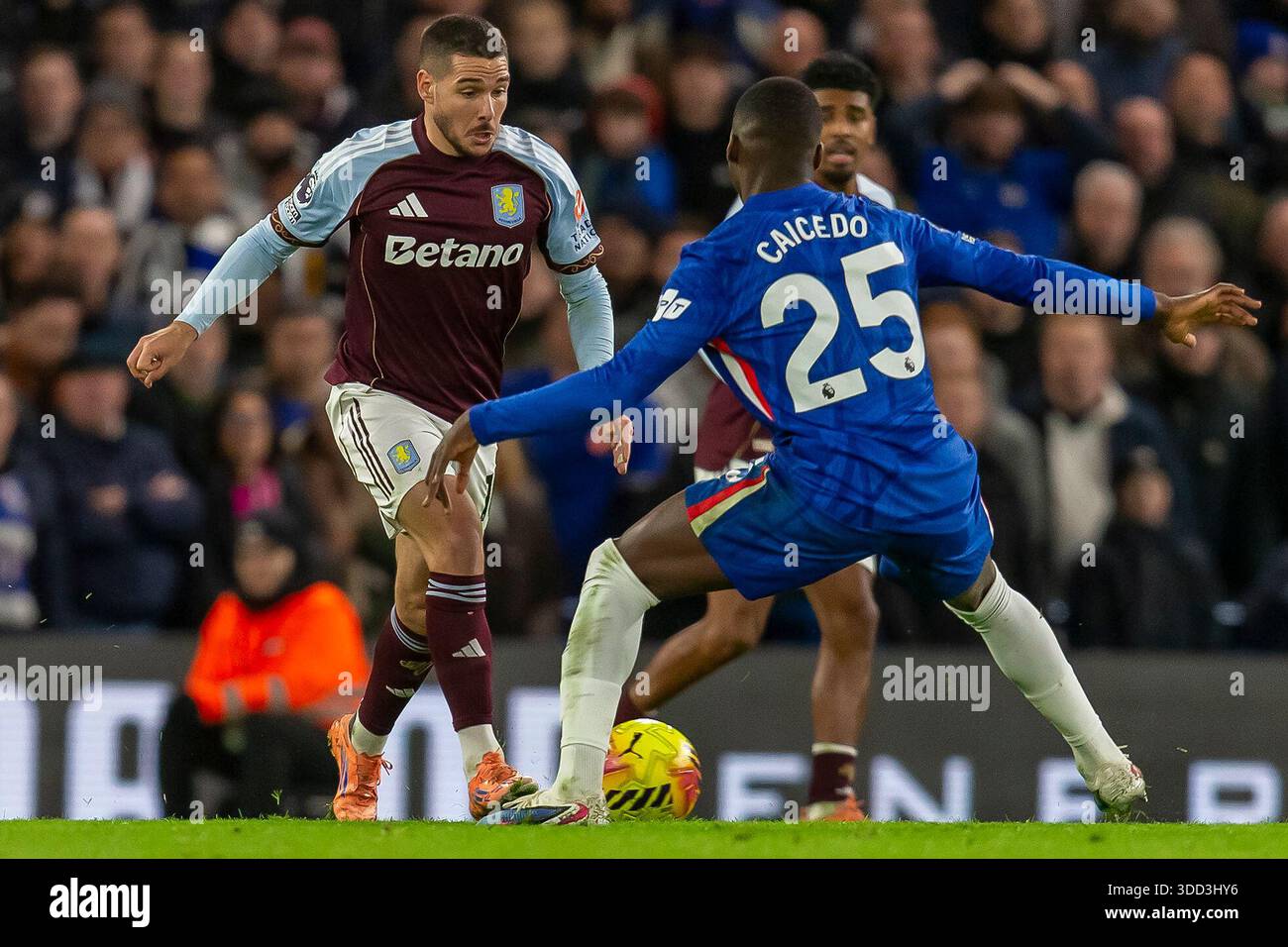 Moisés Caicedo of Chelsea and Emi Buendía of Aston Villa battle for the ...