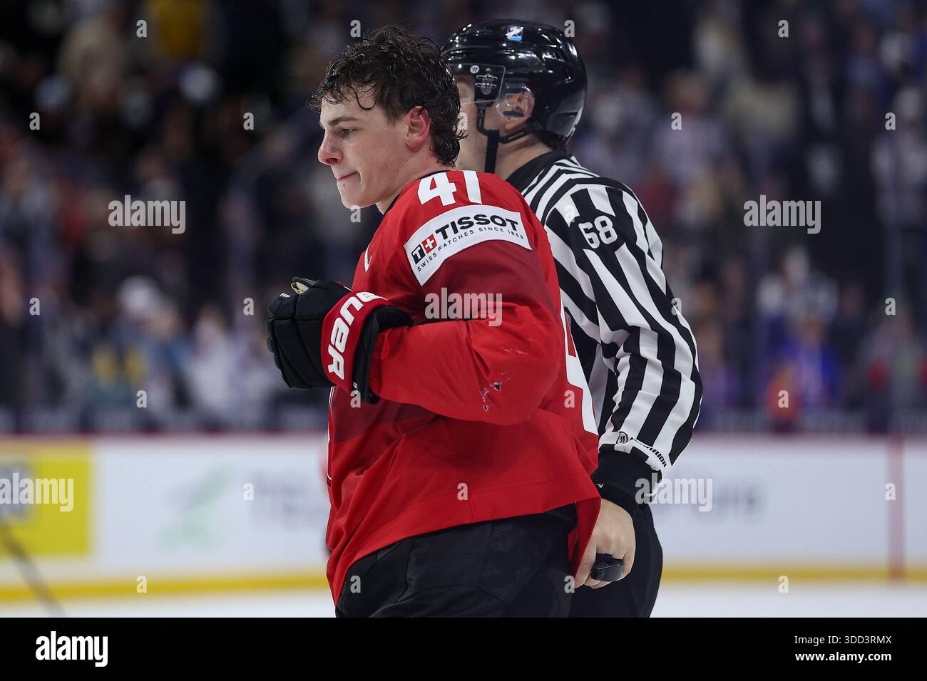 Switzerland defenseman Leon Muggli (41) reacts to his team's loss after ...