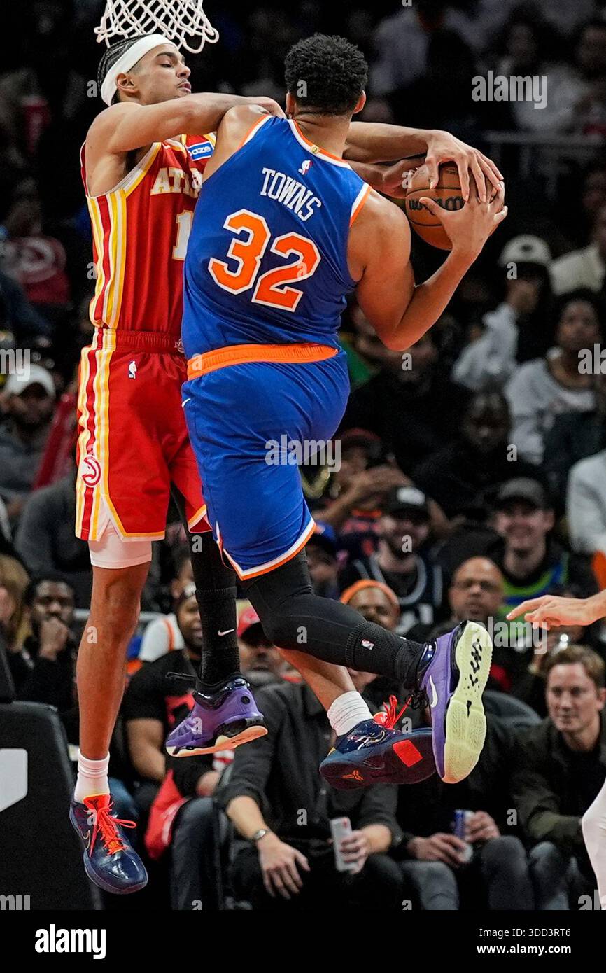 Atlanta Hawks forward Asa Newell (14) stops New York Knicks center Karl ...