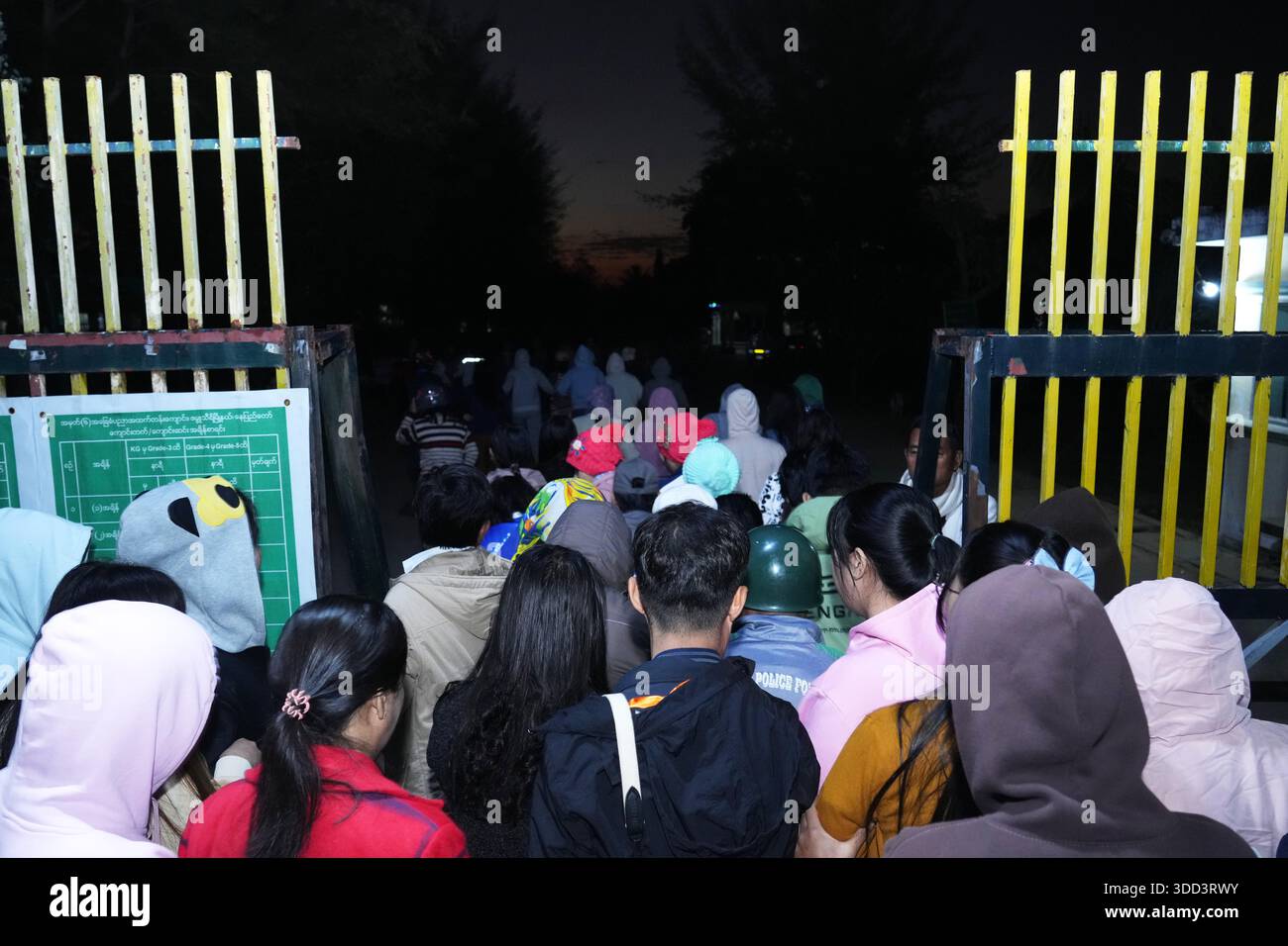 Voters line up to cast their ballots at a polling station in Naypyitaw ...